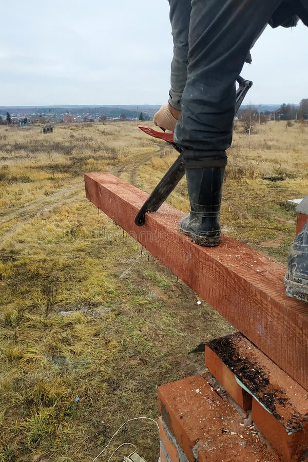 The Master Uses a Saw To Handle and Cut Timber Beam Stock Image - Image ...