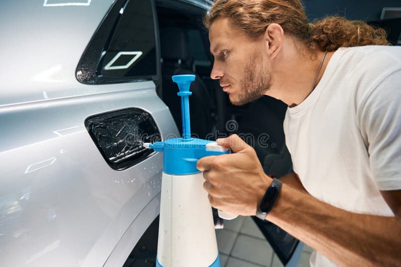 Master Uses a Spray Bottle in Process of Car Detailing Stock Image ...
