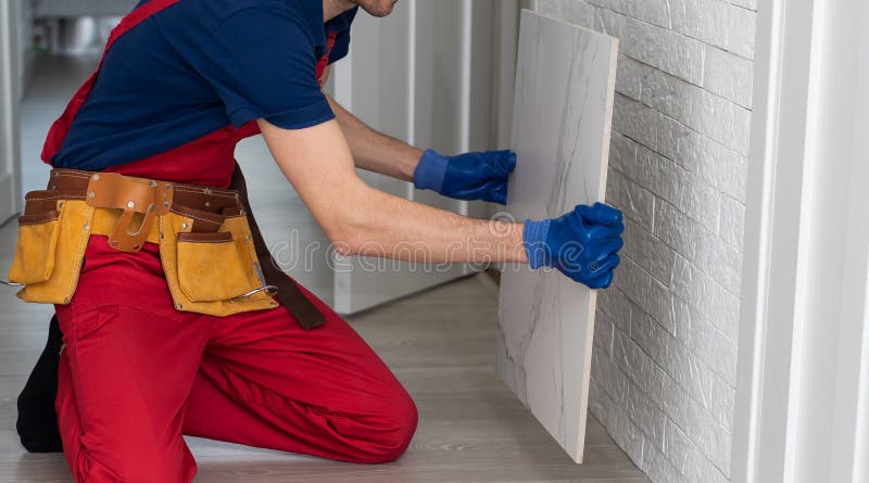 Master is Wearing Work Clothes, is Checking Horizon of Installing Tiles ...