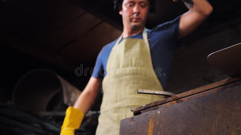Working with Metal in the Workshop. a Man Wearing a Welding Mask To ...