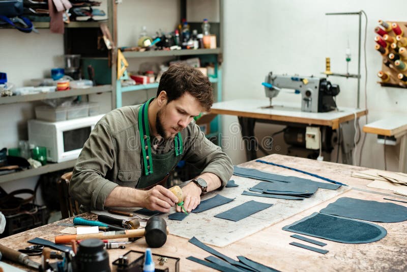A Master Works with Genuine Leather in the Workshop Stock Image - Image ...