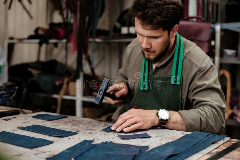 A Master Works with Genuine Leather in the Workshop Stock Image - Image ...