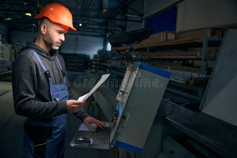 Master Works with Production Documentation at the Workplace Stock Image ...