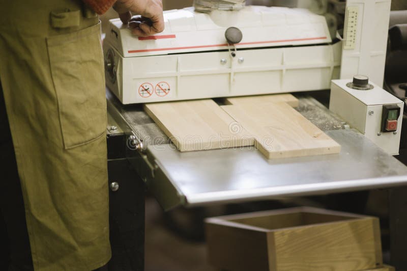 The Master Works on a Surface Grinding Machine in the Carpentry ...