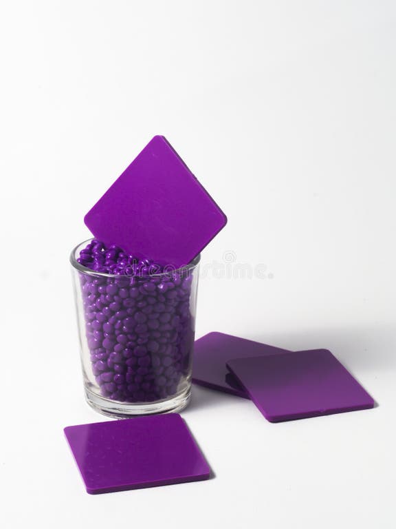 Masterbatch Polymer Granules and Purple Color Chips on a White ...