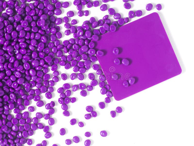 Masterbatch Polymer Granules and Purple Color Chips on a White ...