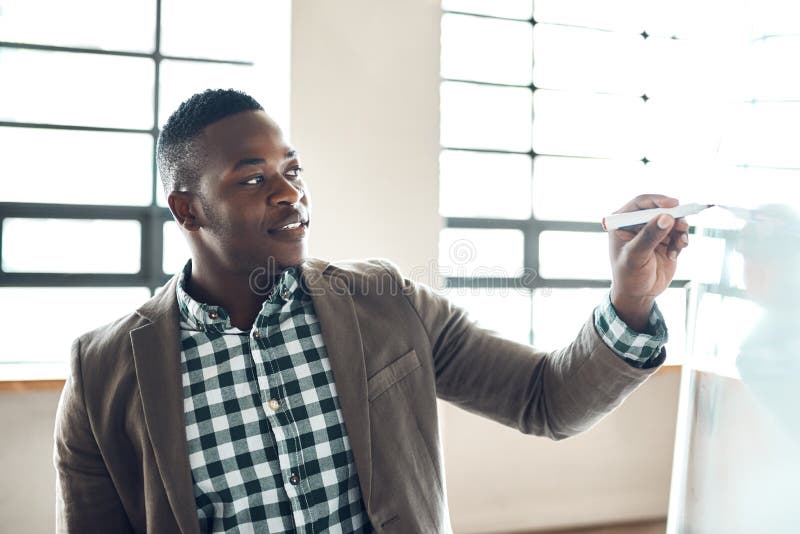The Mastermind is at Work. a Businessman Using a Whiteboard during a ...