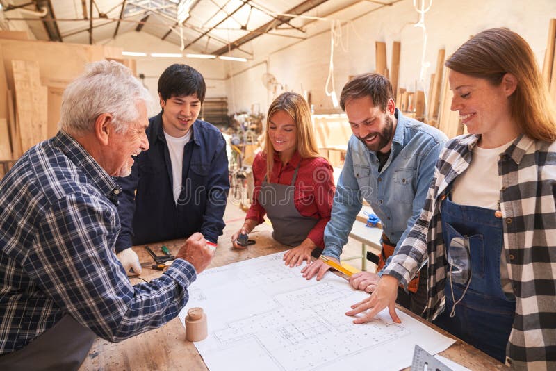 Masters and Apprentices Discuss Construction Drawings Stock Photo ...