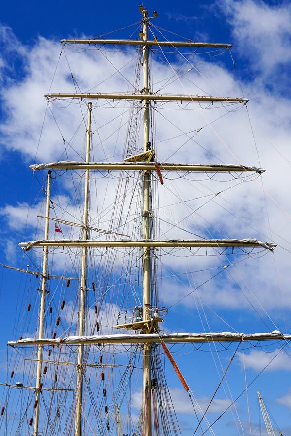 Masts of a Large Sailing Ship with Ropes on a Background of Blue Sky ...