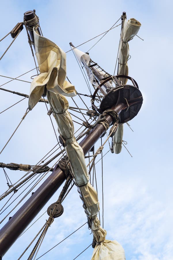 Masts and Rigging of Old Pirate Ship on Background of Cloudy Blue Sky ...