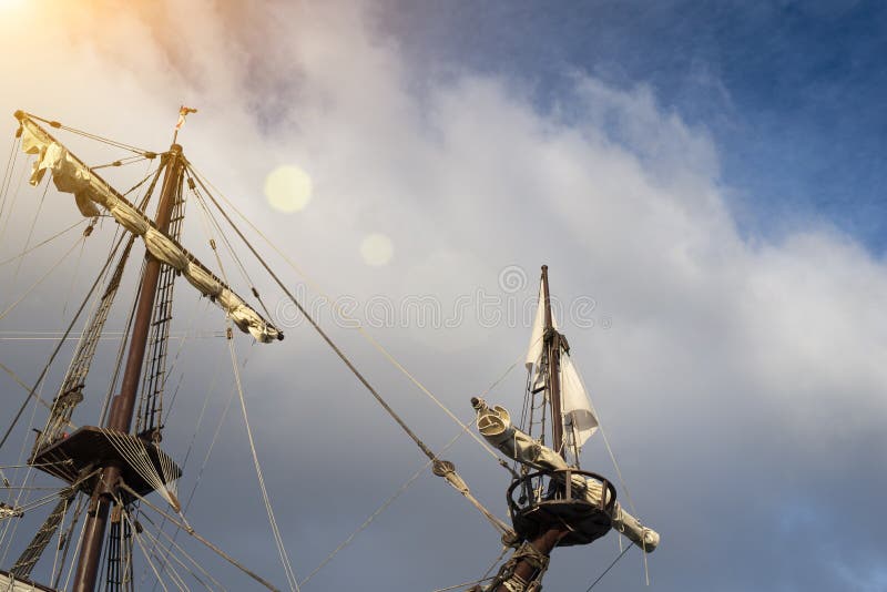 Masts and Rigging of Old Pirate Ship on Background of Cloudy Blue Sky ...