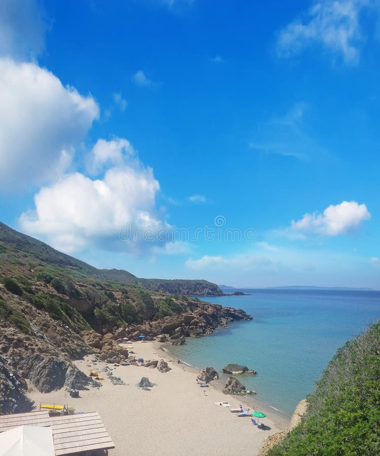 Masua Beach In Sardinia Island, Crowd In Summer Sunny Day. Focus Stock ...