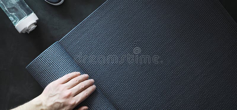 Mat for Practicing Yoga on the Floor. Healthy Lifestyle. Stock Photo ...