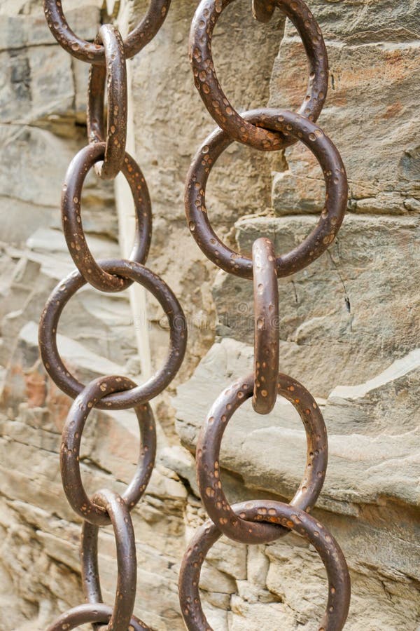 Matal Chains Pairs Hanging by the Side of a Rock Side Stock Image ...