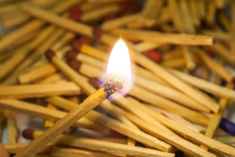 Match Sticks Spread on White Paper and Match Burning in Center Stock ...
