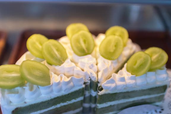 Matcha Cake with Soft Cream and Slice Grape on Top Stock Photo - Image ...