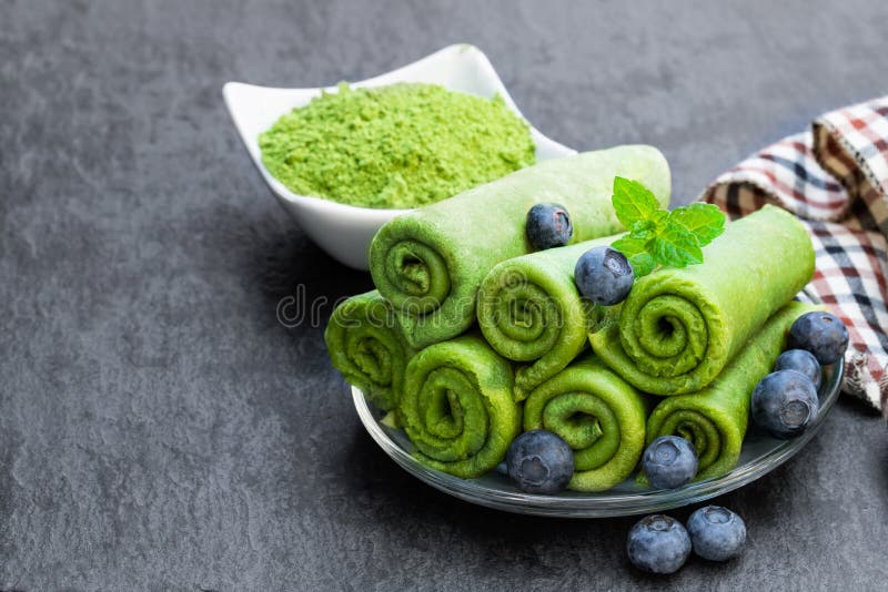 Matcha Green Tea Crepe with Blueberry on Black Stone Table Stock Photo ...