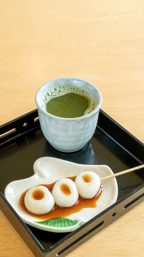 Matcha Green Tea and Dango (Japanese Dessert) on a Wooden Table Stock ...