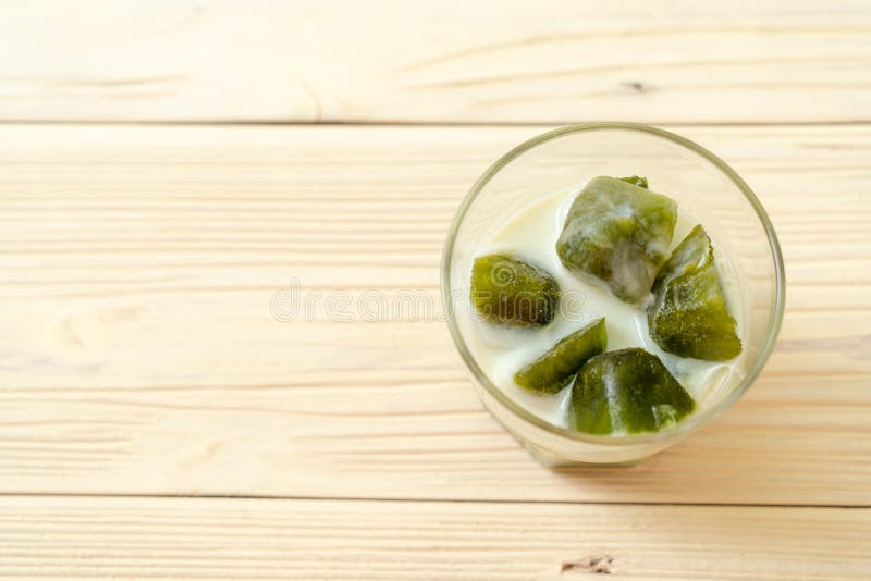 Matcha Green Tea Ice Cube with Milk Stock Image - Image of wooden, cafe ...