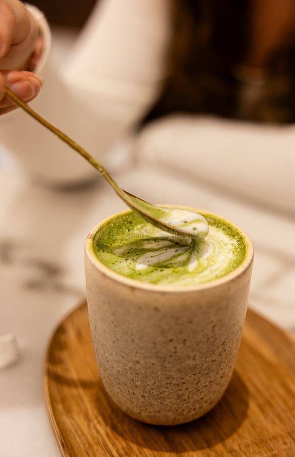 Matcha Latte in Ceramic Mug with a Golden Spoon Stock Photo - Image of ...
