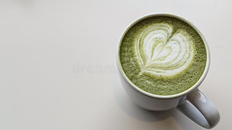 Matcha Latte in a Ceramic Mug with Heart Foam. the Photo Highlights a ...