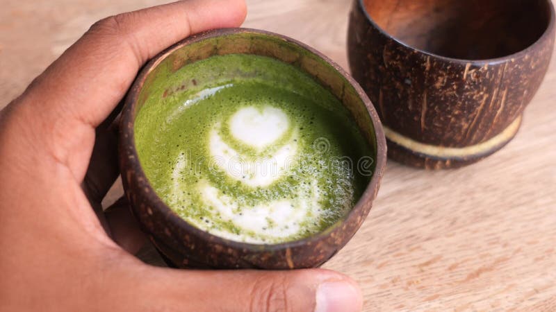 Matcha Latte in a Coconut Cup on Table Stock Video - Video of green ...
