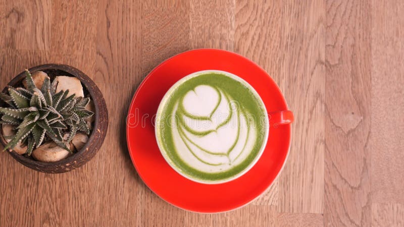 Matcha Latte in a Red Color Cup on Table Stock Video - Video of ...