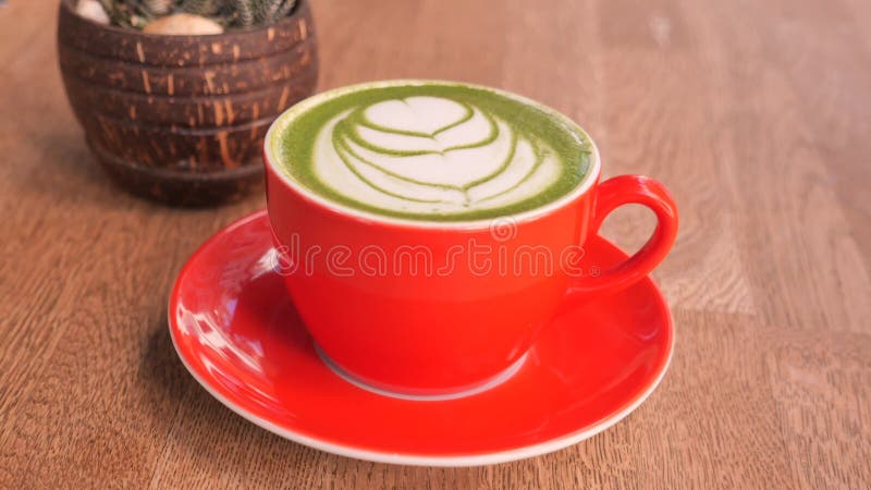 Matcha Latte in a Red Color Cup on Table Stock Video - Video of ...