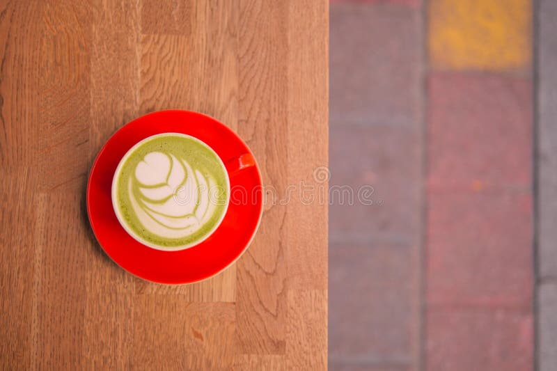 Matcha Latte in a Red Color Cup on Table Stock Image - Image of ...