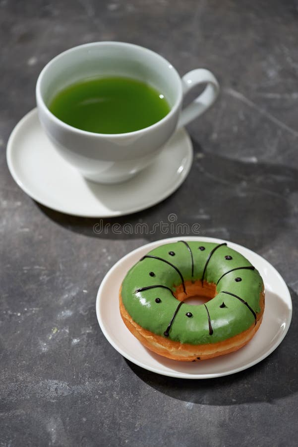 Matcha and White Chocolate Donuts with Matcha Tea Latte Stock Photo ...