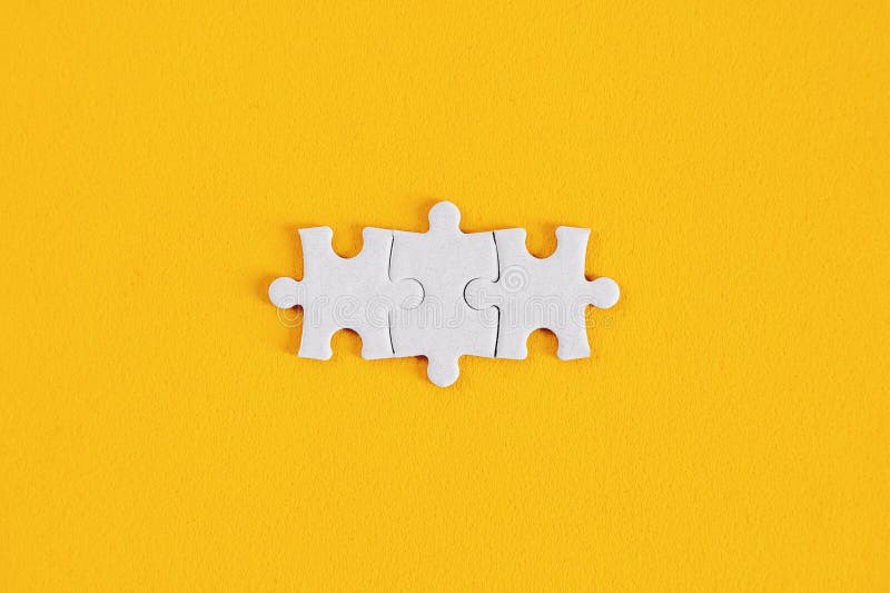 Matching Puzzle Pieces on Yellow Background Stock Photo - Image of ...