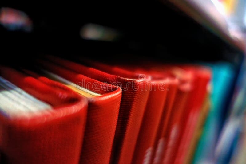 Red Reference Books in the Stacks of a Library. Stock Image - Image of ...