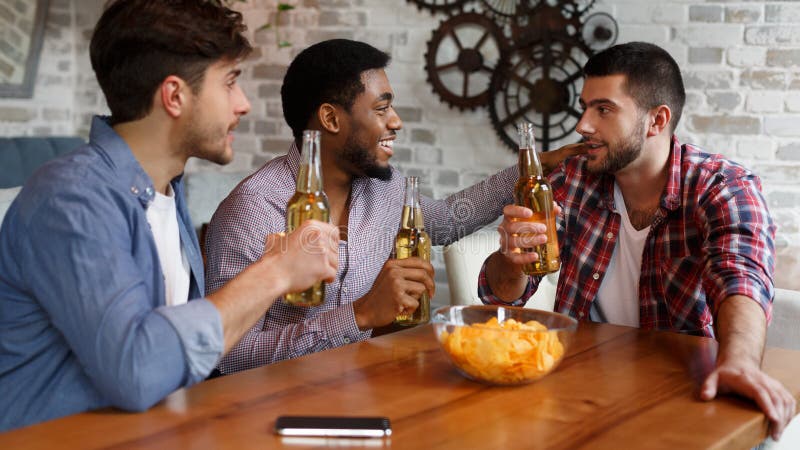 Mates Eating Chips and Drinking Beer in Pub Stock Image - Image of ...