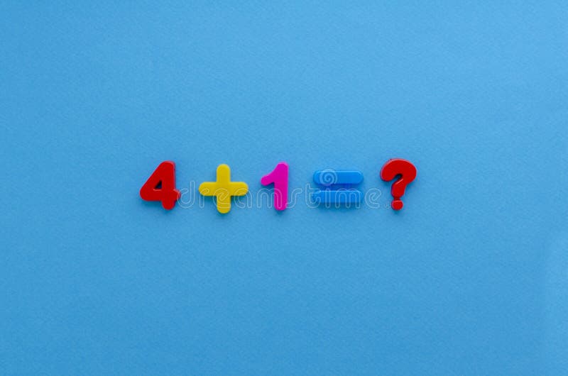 Math Action from Colored Plastic Numbers on Blue Paper Background Stock ...