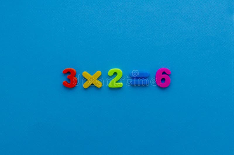 Math Action from Colored Plastic Numbers on Blue Paper Background Stock ...