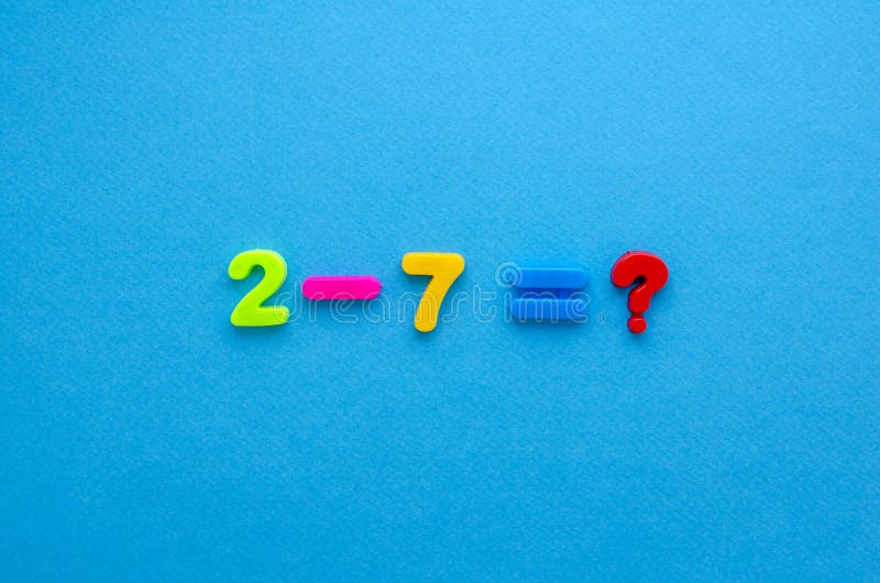 Math Action from Colored Plastic Numbers on Blue Paper Background Stock ...