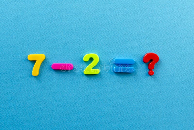 Math Action from Colored Plastic Numbers on Blue Paper Background Stock ...