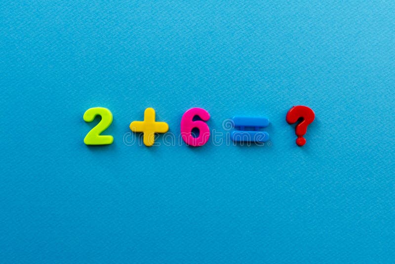 Math Action from Colored Plastic Numbers on Blue Paper Background Stock ...