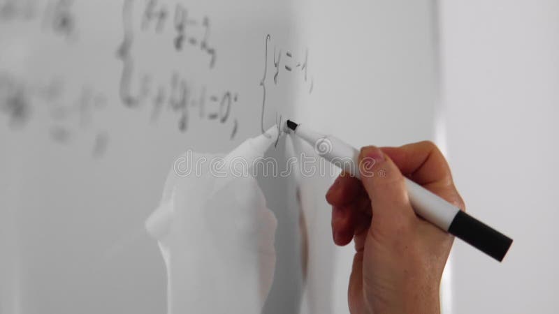 Female Student is Writing Math Equation on Whiteboard in the Cabinet ...