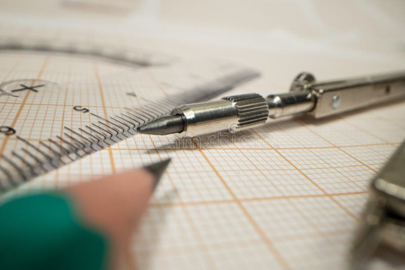 Math Concept - Macro of a Pencil on a Piece of Paper with Geometric ...