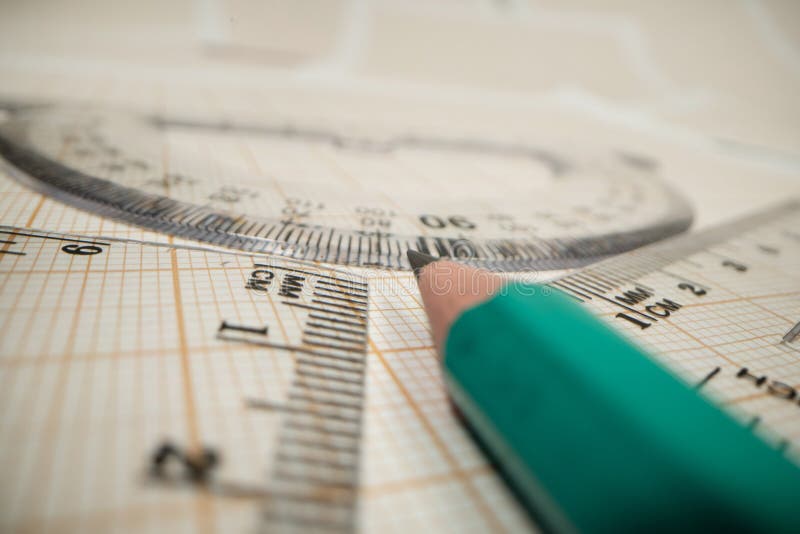 Math Concept - Macro of a Pencil on a Piece of Paper with Geometric ...