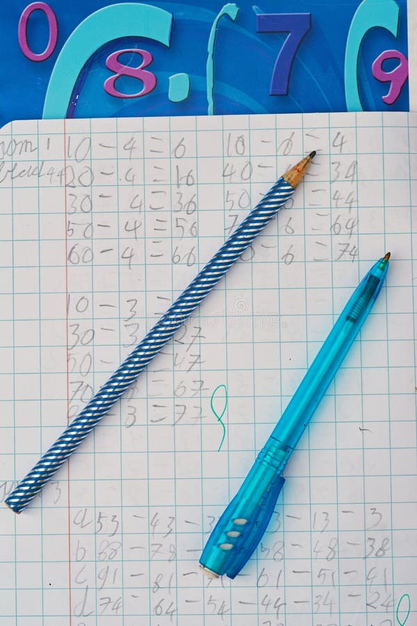 Math Exercises Written in a Textbook with a Pen and Pencil on it ...