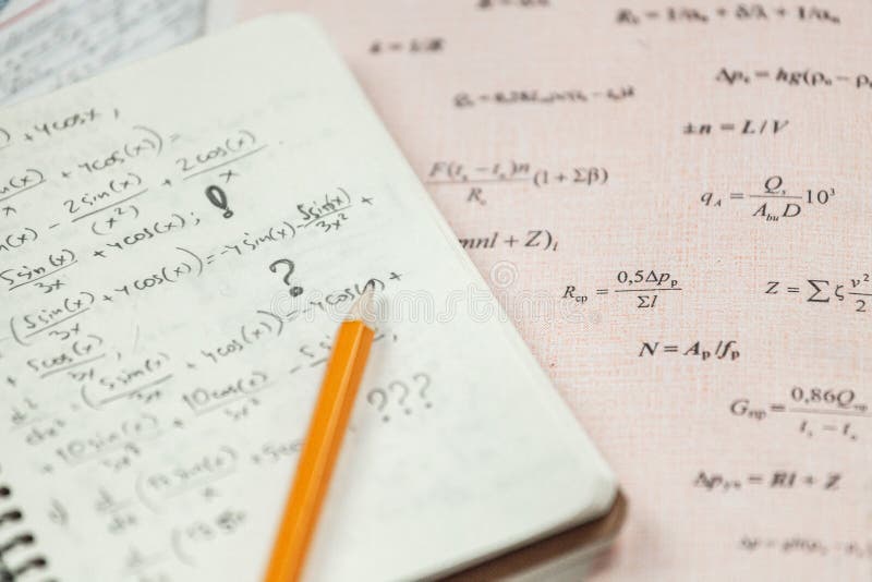 Math Formulas are Written in Pencil on a Piece of Paper, Math Problems ...