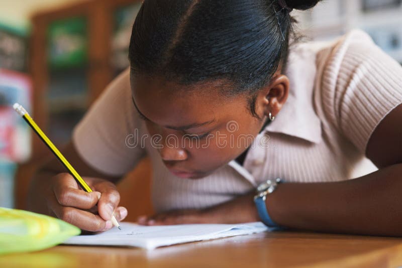 This Math Sum Requires All My Focus. a Young Girl Sitting Alone in Her ...