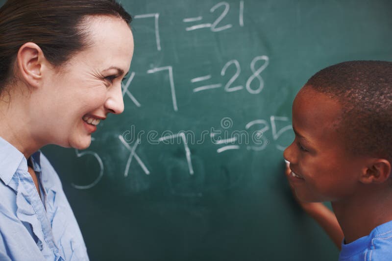 Math, Teacher and Boy Learning at Chalkboard in Classroom for Solving ...