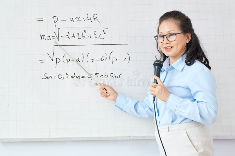 Math Teacher Explaining Topic Stock Photo - Image of classroom, student ...