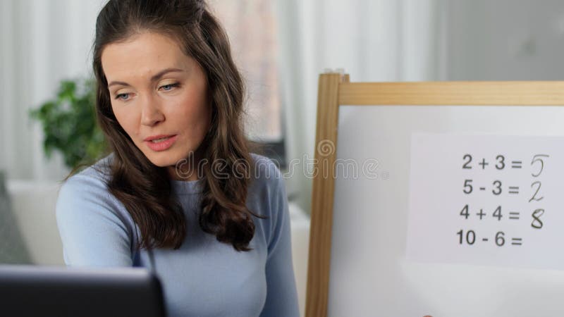 Math Teacher Having Online Class on Laptop at Home Stock Video - Video ...