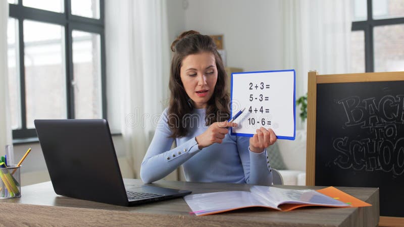 Math Teacher Having Online Class on Laptop at Home Stock Video - Video ...