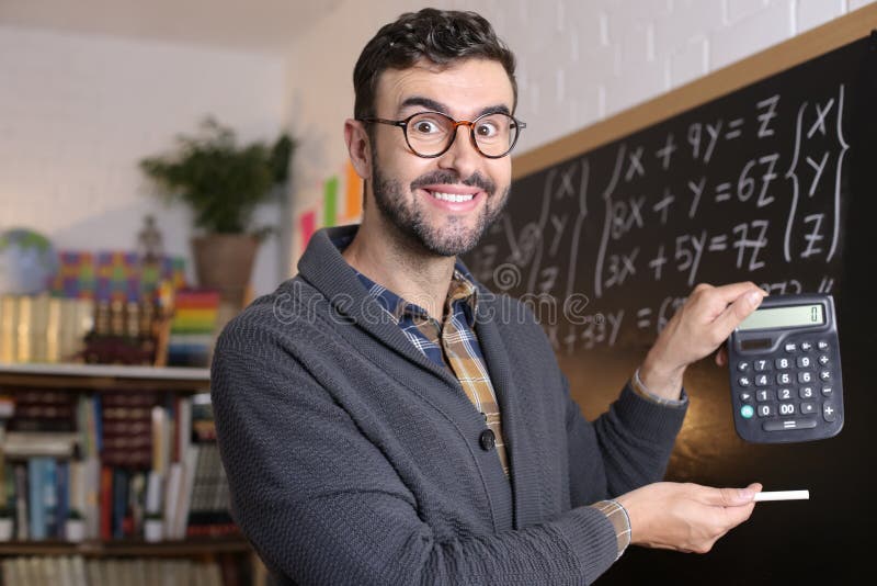 Math Teacher Holding a Calculator in Classroom Stock Image - Image of ...