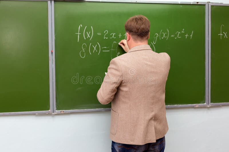 A Chemistry Teacher at His Desk in School Classroom Stock Image - Image ...